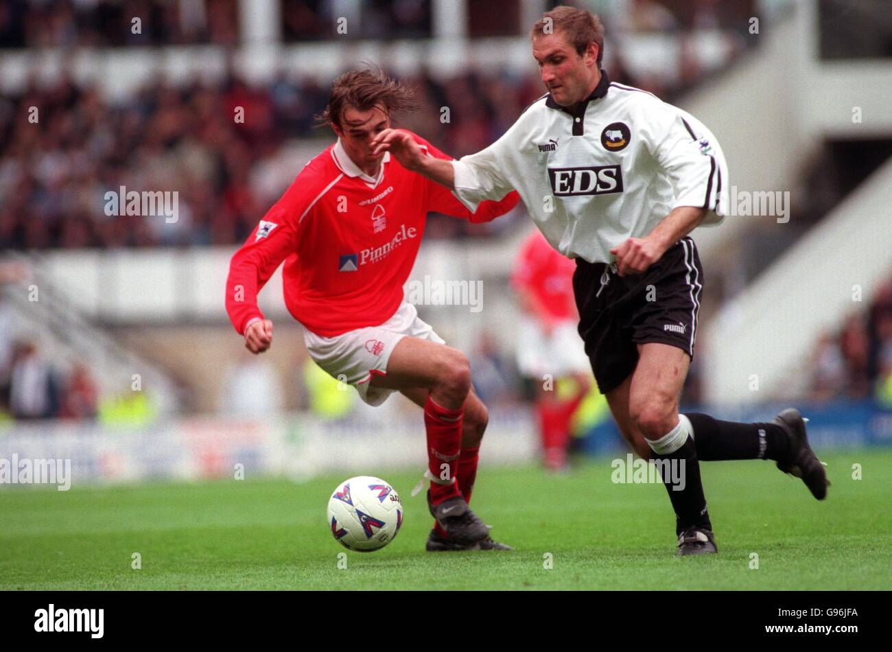 L-R; Nottingham Forest's Christian Edwards is unable to challenge Derby ...
