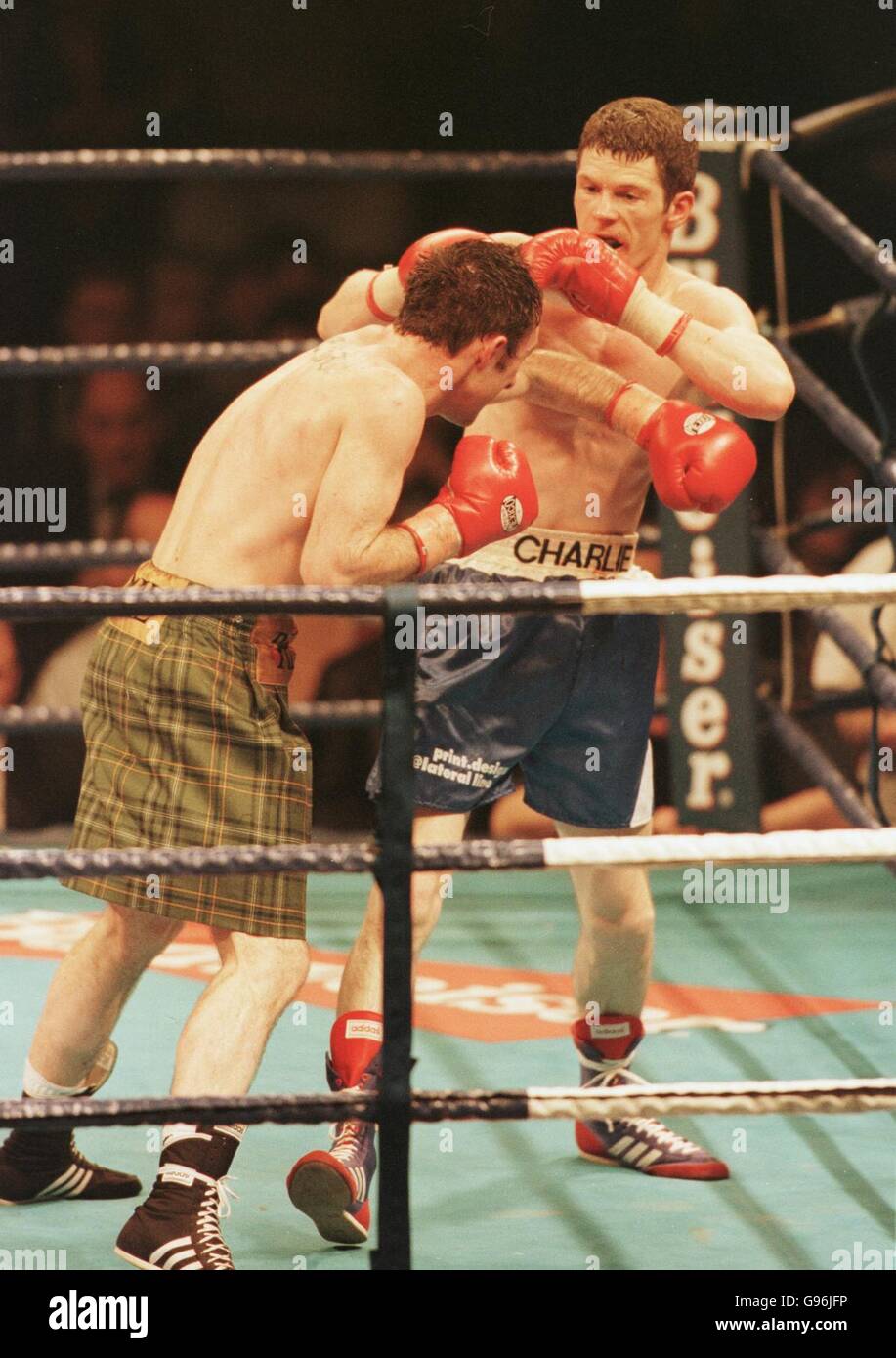 Charlie Kane (facing) covers up as Derek Roache launches an attack ...