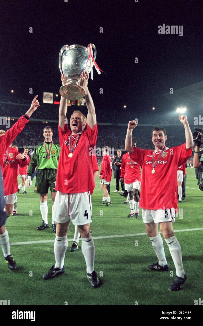 Manchester United's David May (left) lifts the European Cup as teammate ...