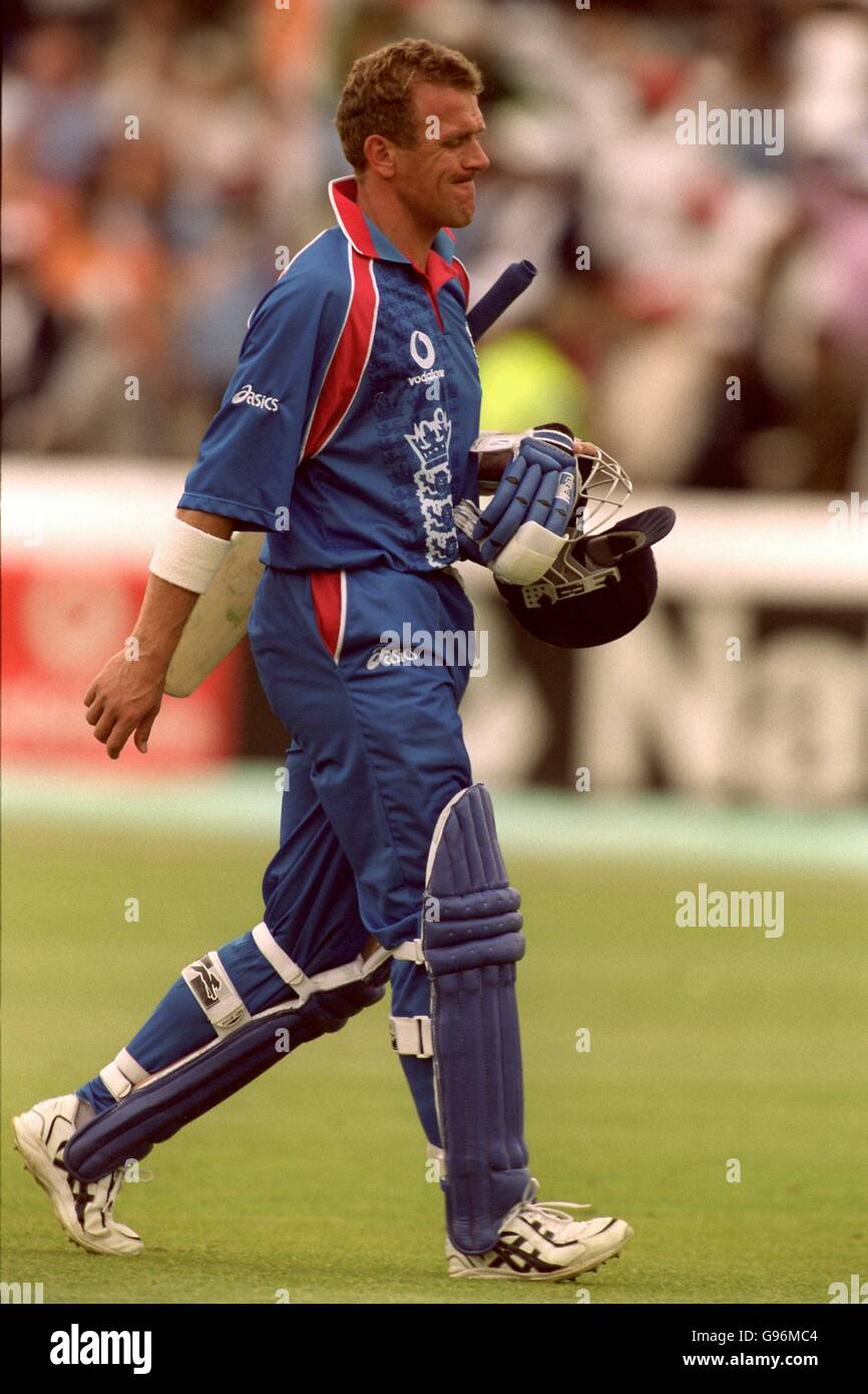 England's Captain Alec Stewart walks from the field after being caught ...