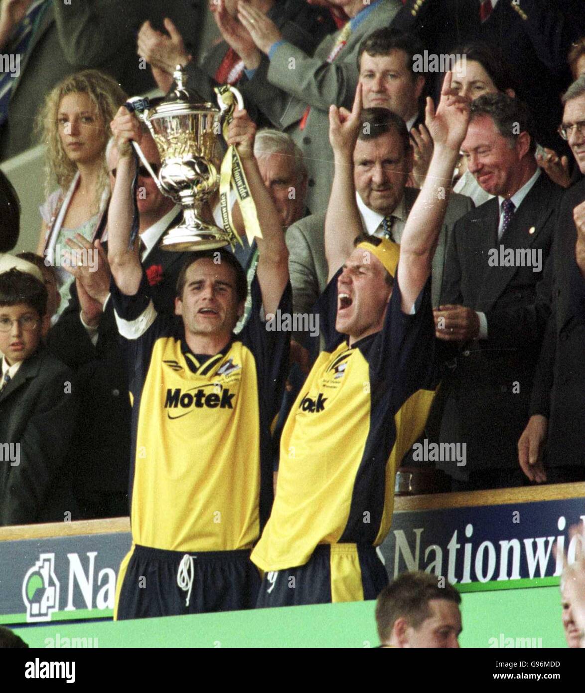 Scunthorpe United's captain lifts the trophy after his side's victory ...