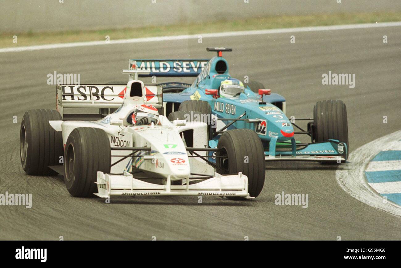 Johnny herbert stays ahead of a sideways giancarlo fisichella hi-res ...