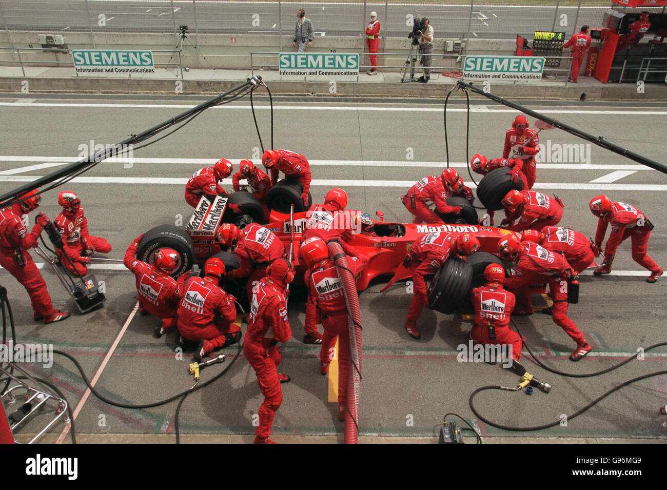 Formula One Motor Racing - Spanish Grand Prix. Michael Schumacher's Ferrari is serviced by the ...