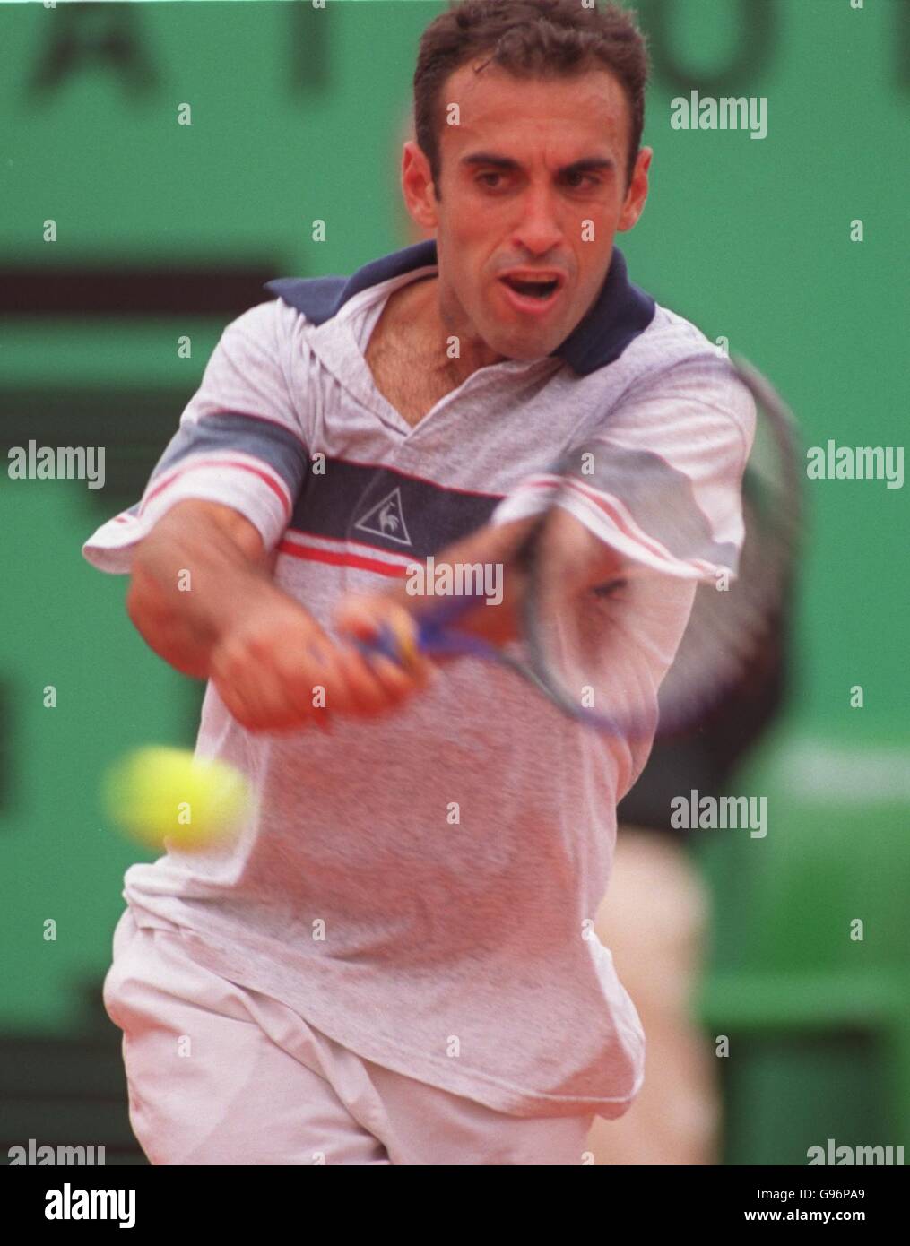 Hector moretti powers a two handed return hi-res stock photography and ...