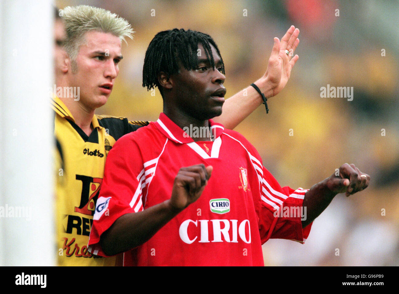 Standard Liege's Mbo Mpenza (right) is closely marked by Lierse SK's ...
