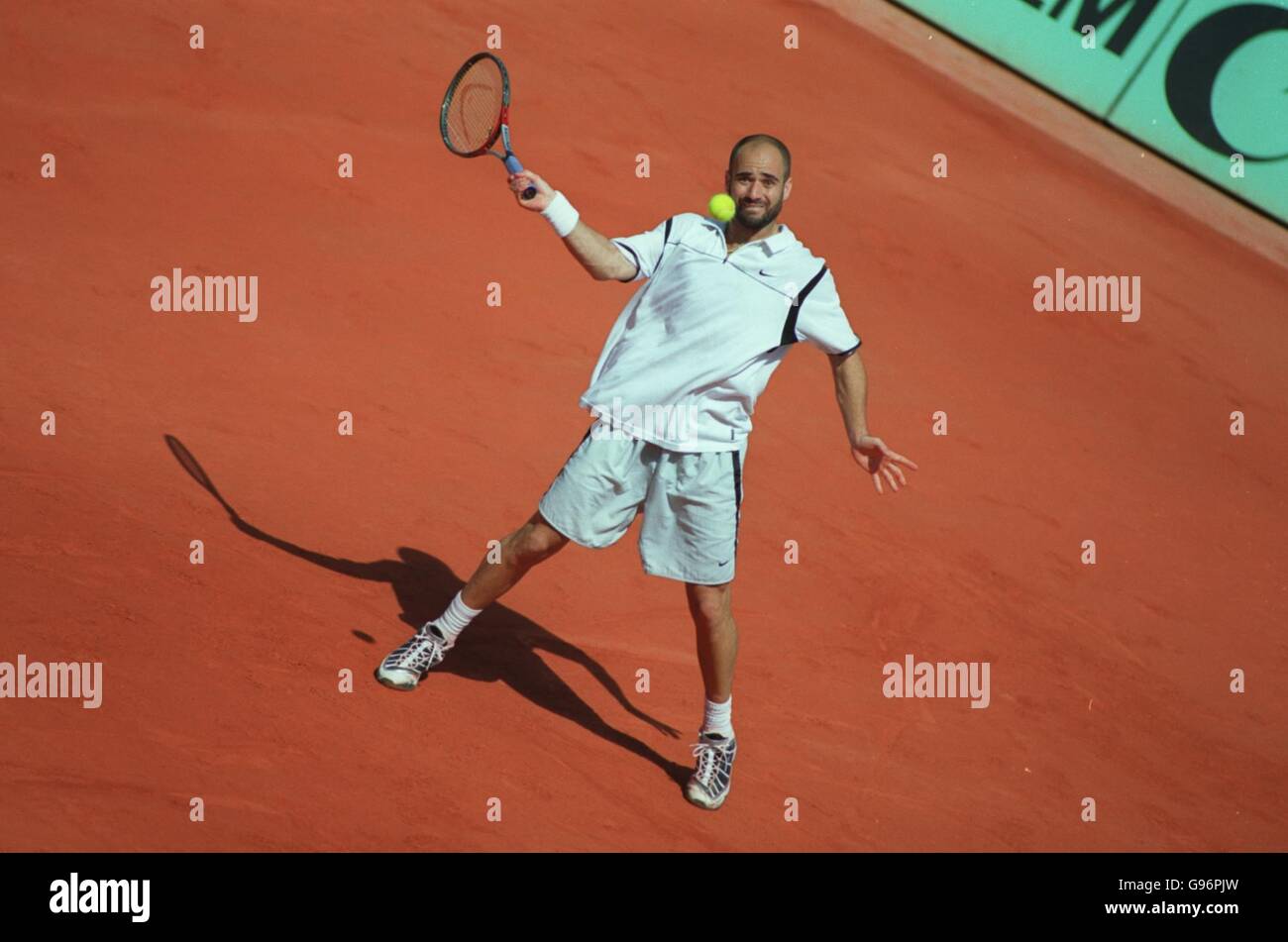 Tennis - French Open - Mens Singles Final. Andre Agassi returns the ...