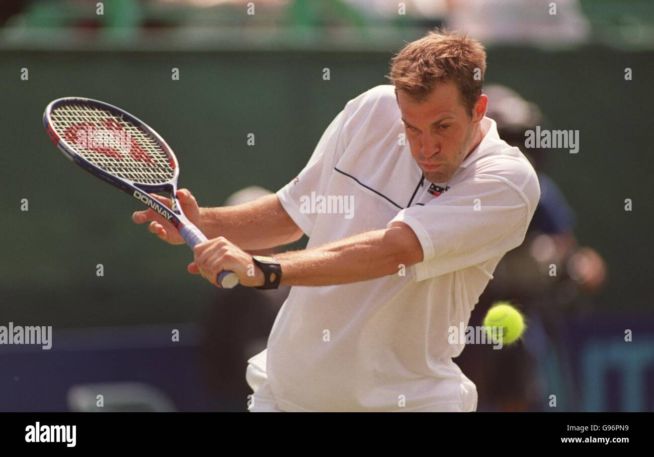 Greg Rusedski returns a ball from his opponent Jan-Michael Gambill ...