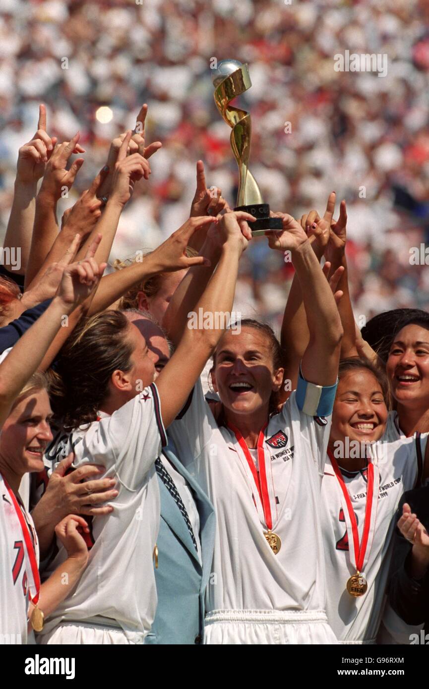 USA's Carla Overbeck lifts the Womens World Cup, to the joy of her ...