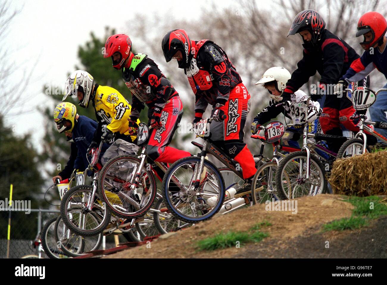 BMX racers set off at the start of a race while the next race waits in ...