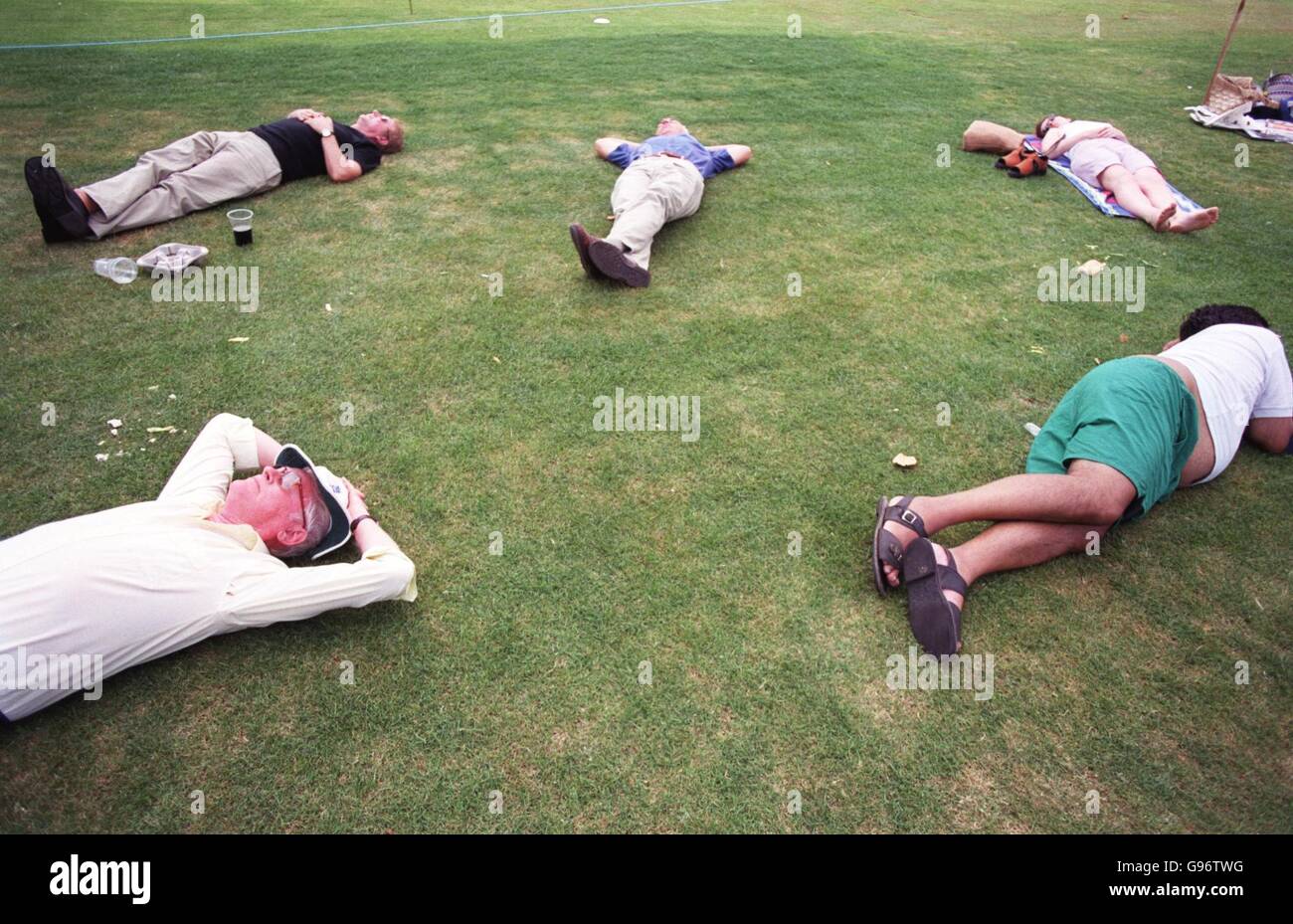 Cricket fans stretch out in sun hi-res stock photography and images - Alamy