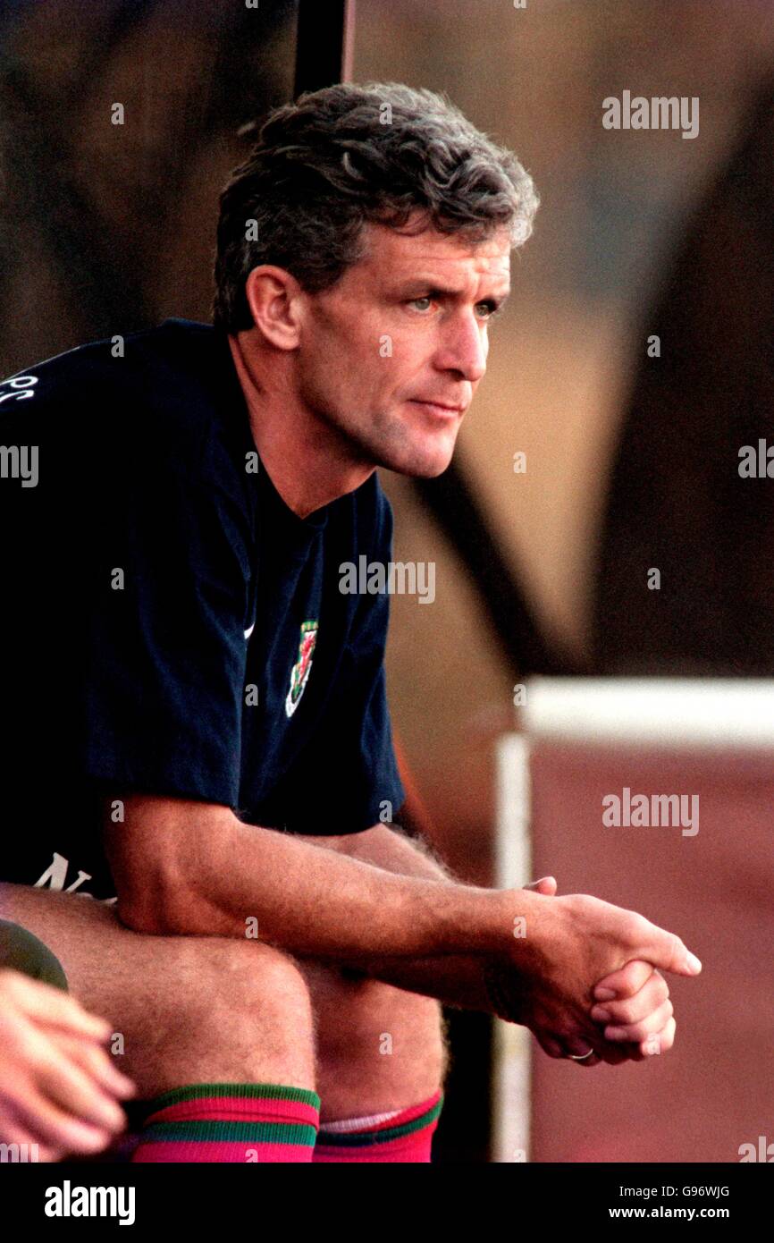 Wales's manager Mark Hughes sits on the bench for his first game in ...