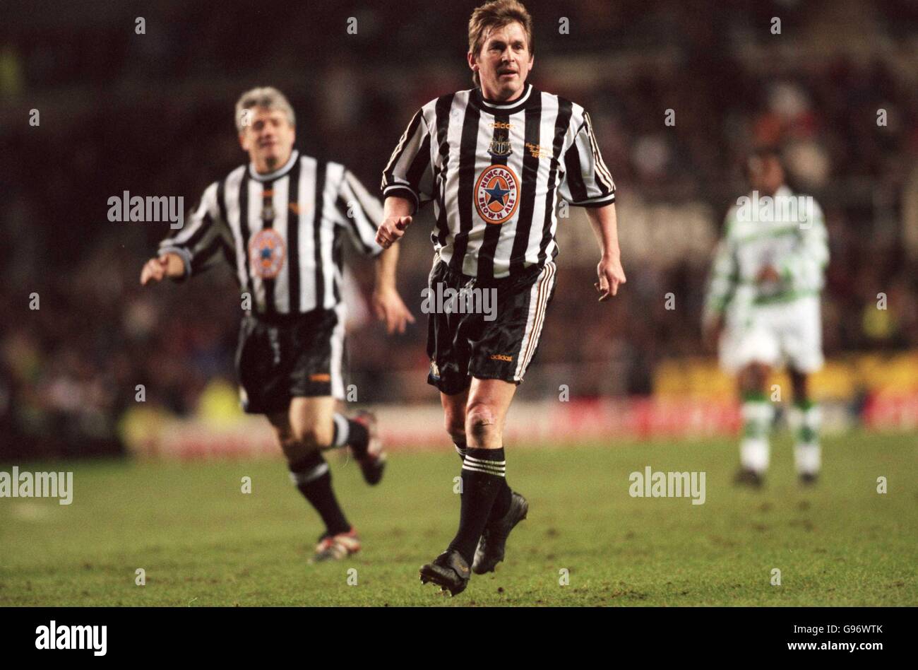 Kenny Dalglish (right), playing for the Peter Beardsley Select XI, with ...