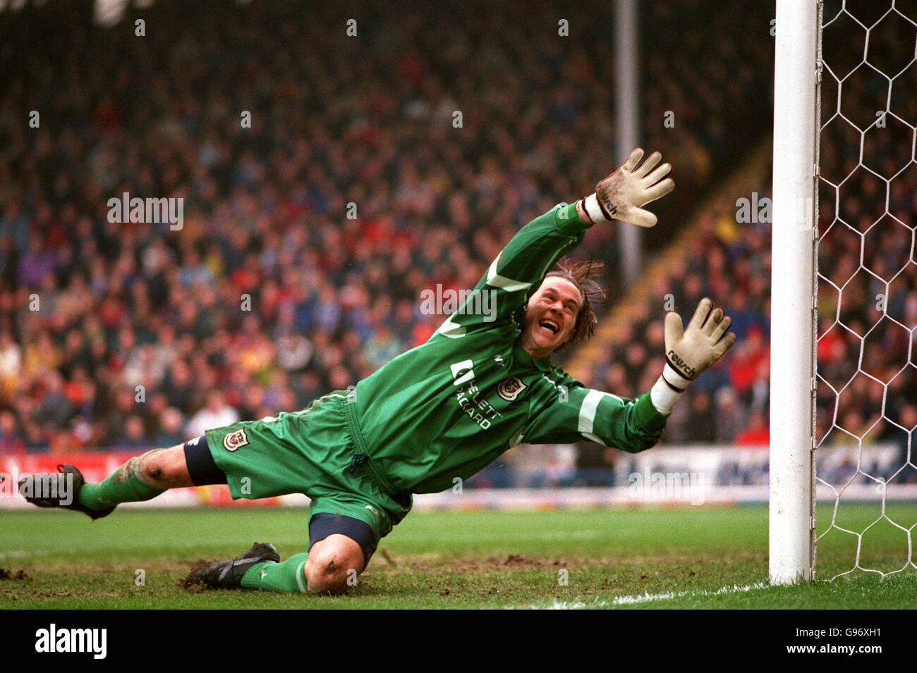 Tottenham hotspur goalkeeper ian walker dives to make a save hi-res ...