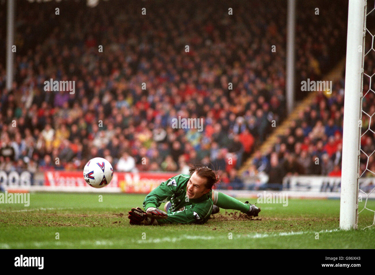 Tottenham hotspur goalkeeper ian walker dives to make a save hi-res ...