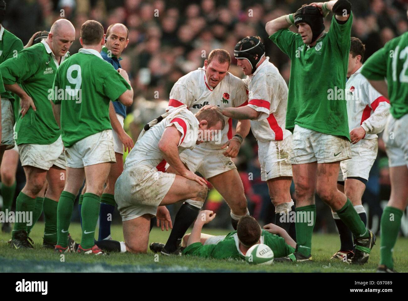 England's Tim Rodber celebrates England's last try as Irish player look ...