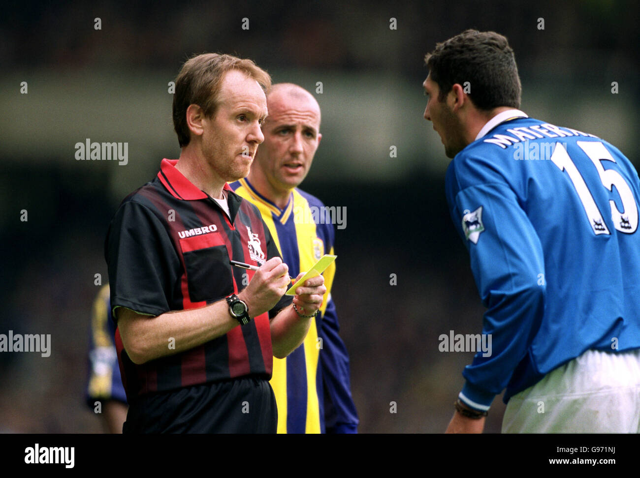 Referee Rob Harris (left) books Everton's Marco Materazzi (right) as ...
