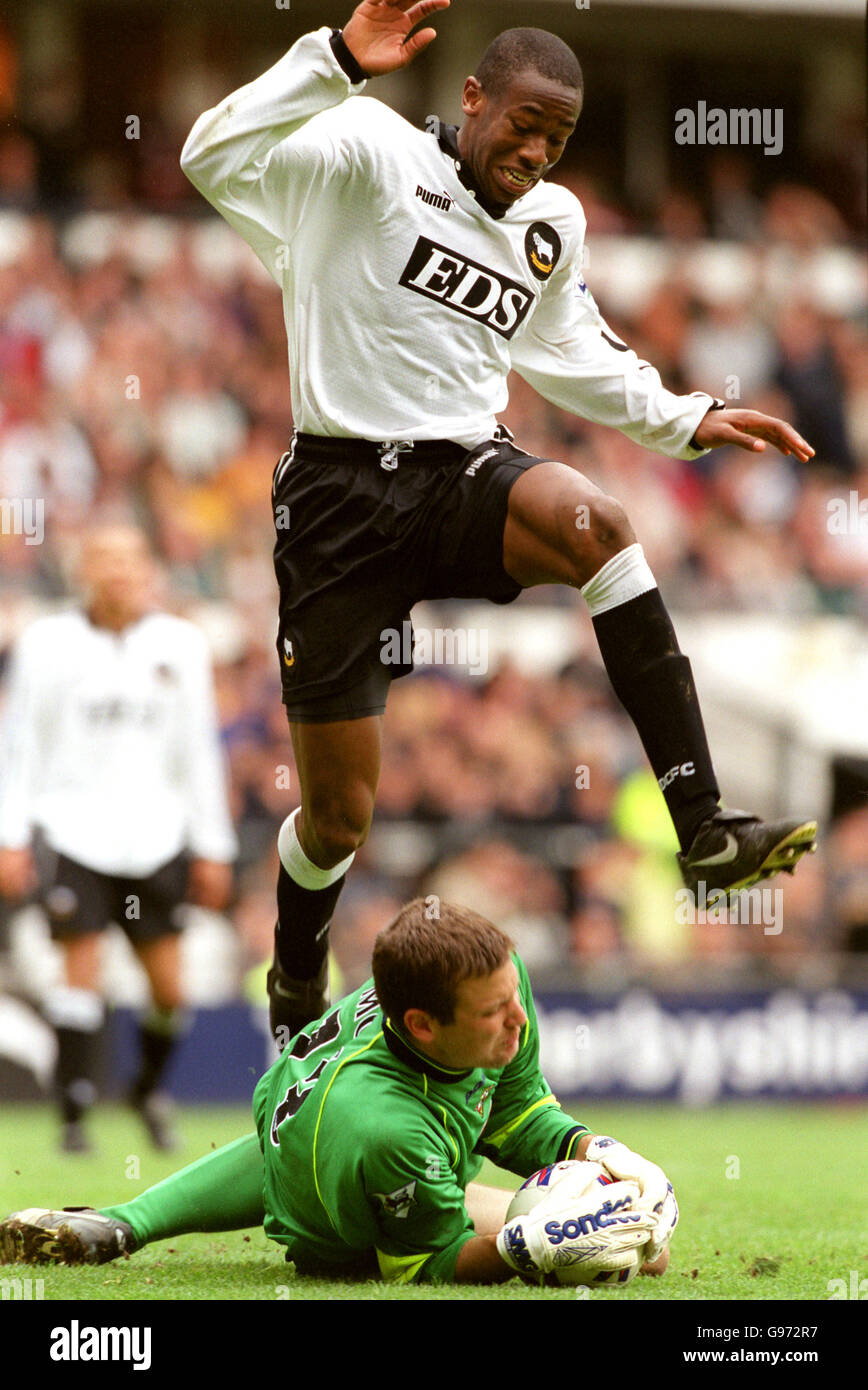 L-R; Paulo Wanchope, Derby County jumps over Neil Moss, Southampton ...
