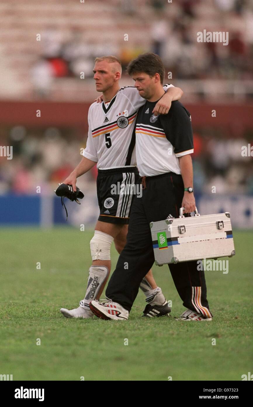 Germany's Thomas Lechner is taken off the pitch injured Stock Photo - Alamy