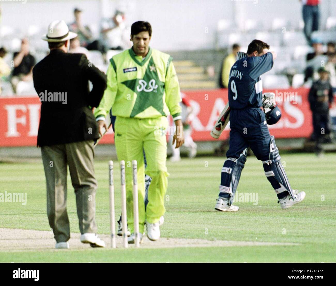 Scotland batsman Gavin Hamilton walks to the pavilion after being ...