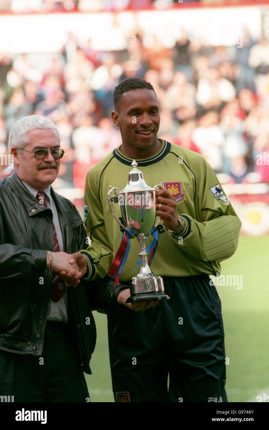 West Ham United's Shaka Hislop is presented with his trophy at the end ...