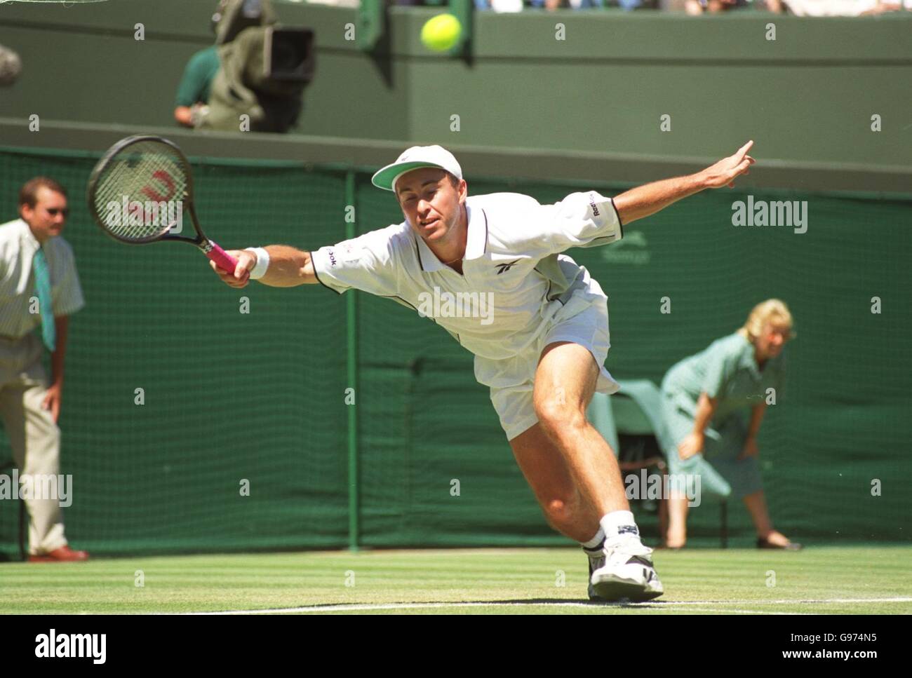 Tennis - Wimbledon. Danny Sapsford lunged to return Pete Sampras' serve ...