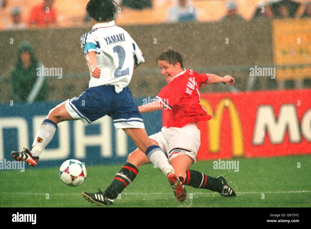 Japan's Rie Yanaki (left) tries to block a cross from Norway's Monica ...