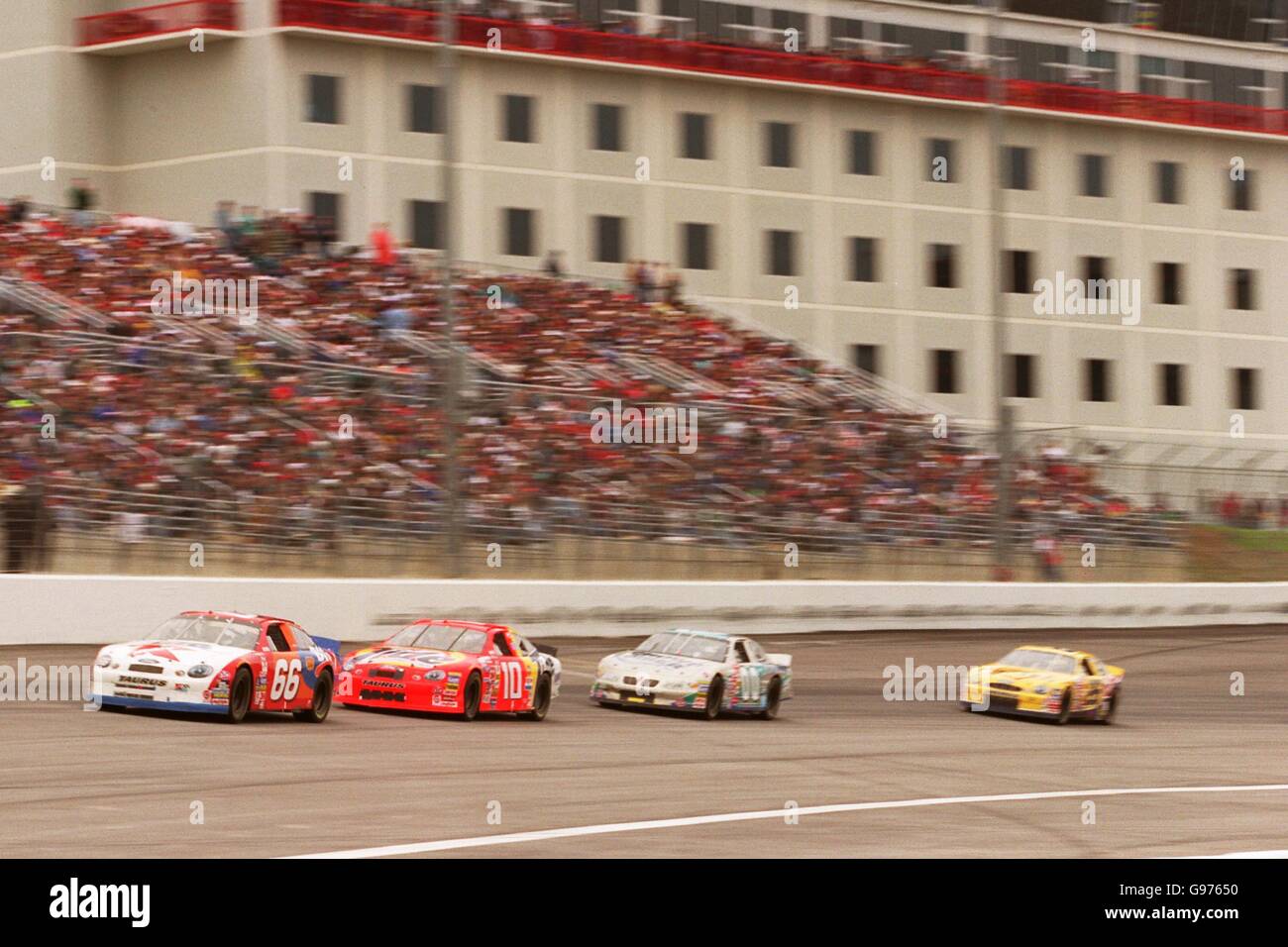 Darrell Waltrip (left) leads from Ricky Rudd (second left) and Buckshot ...