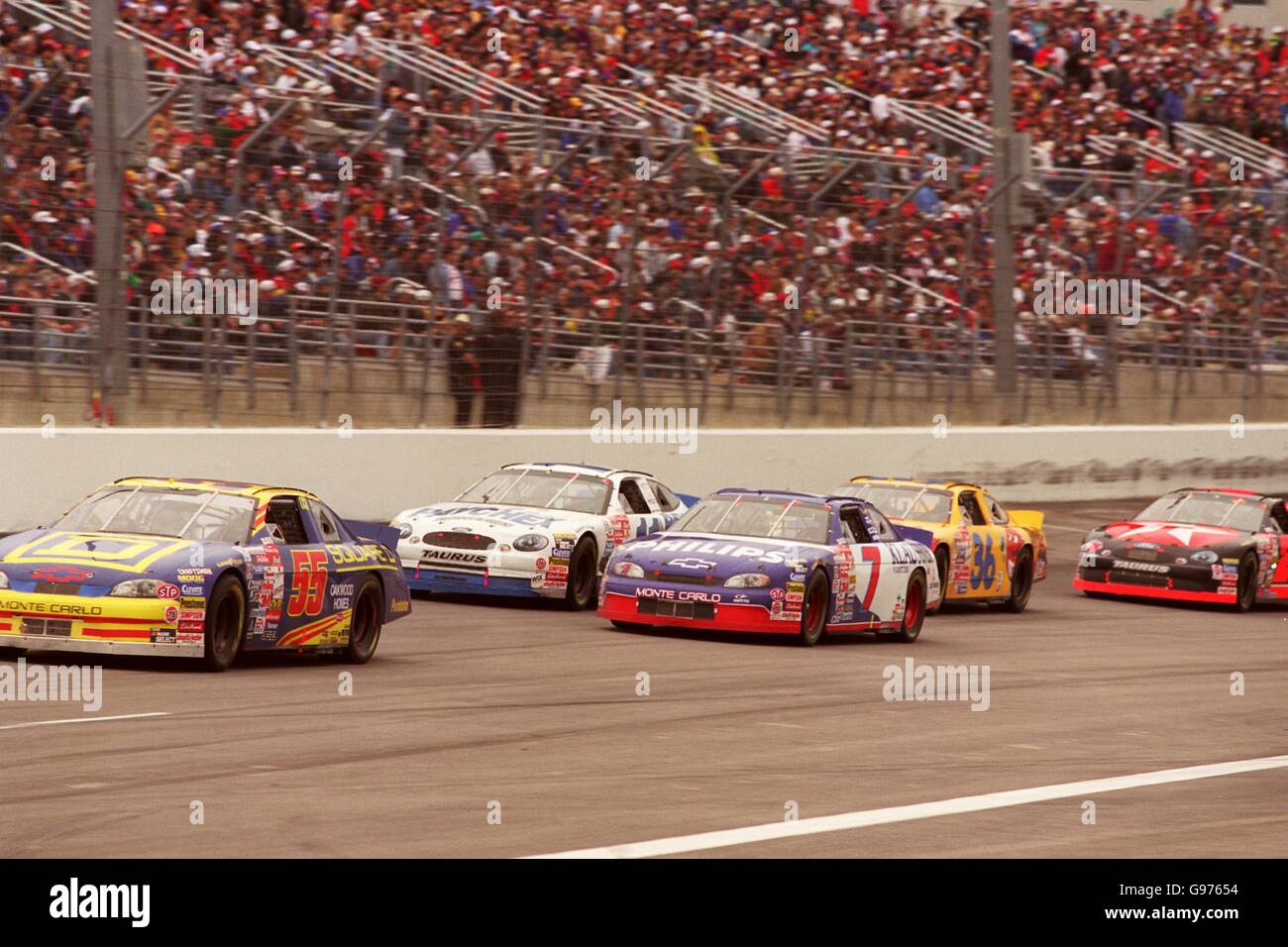 (left-right) Kenny Wallace leads from Brett Bodine, Michael Waltrip ...