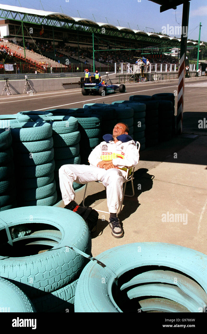 Relaxing piles of tyres hiding skiving asleep sleeping f1 hi-res stock ...