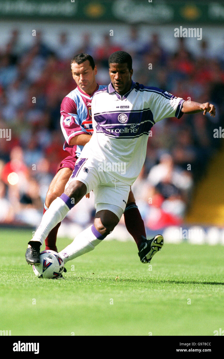 Middlesbrough's Hamilton Ricard (right) shields the ball from Aston ...