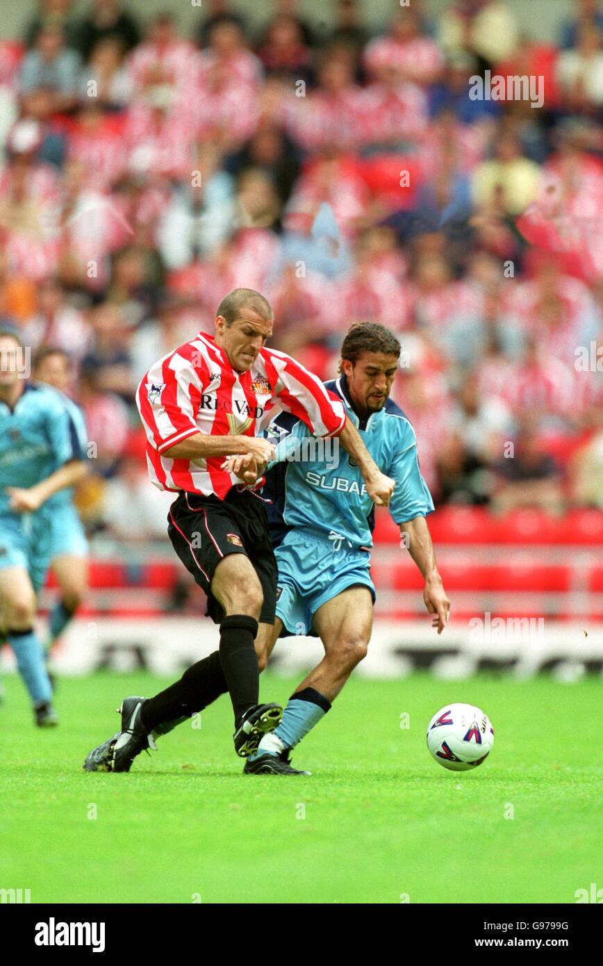 L-R Sunderland's Alex Rae & Coventry City's Moustapha Hadji battle for ...