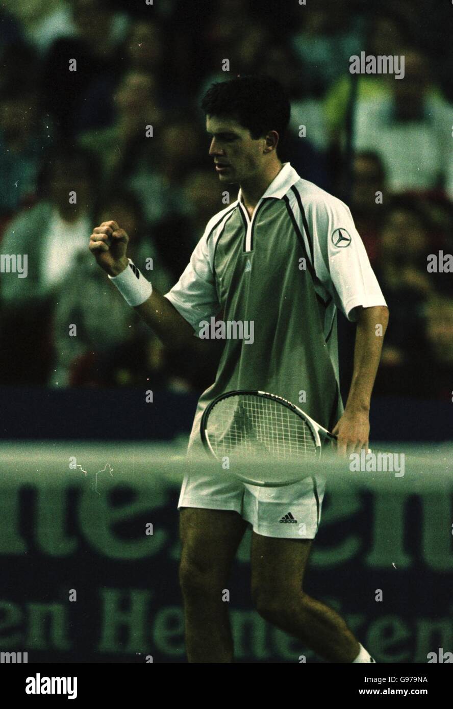 Tim Henman celebrates taking the second set against South Africa's ...