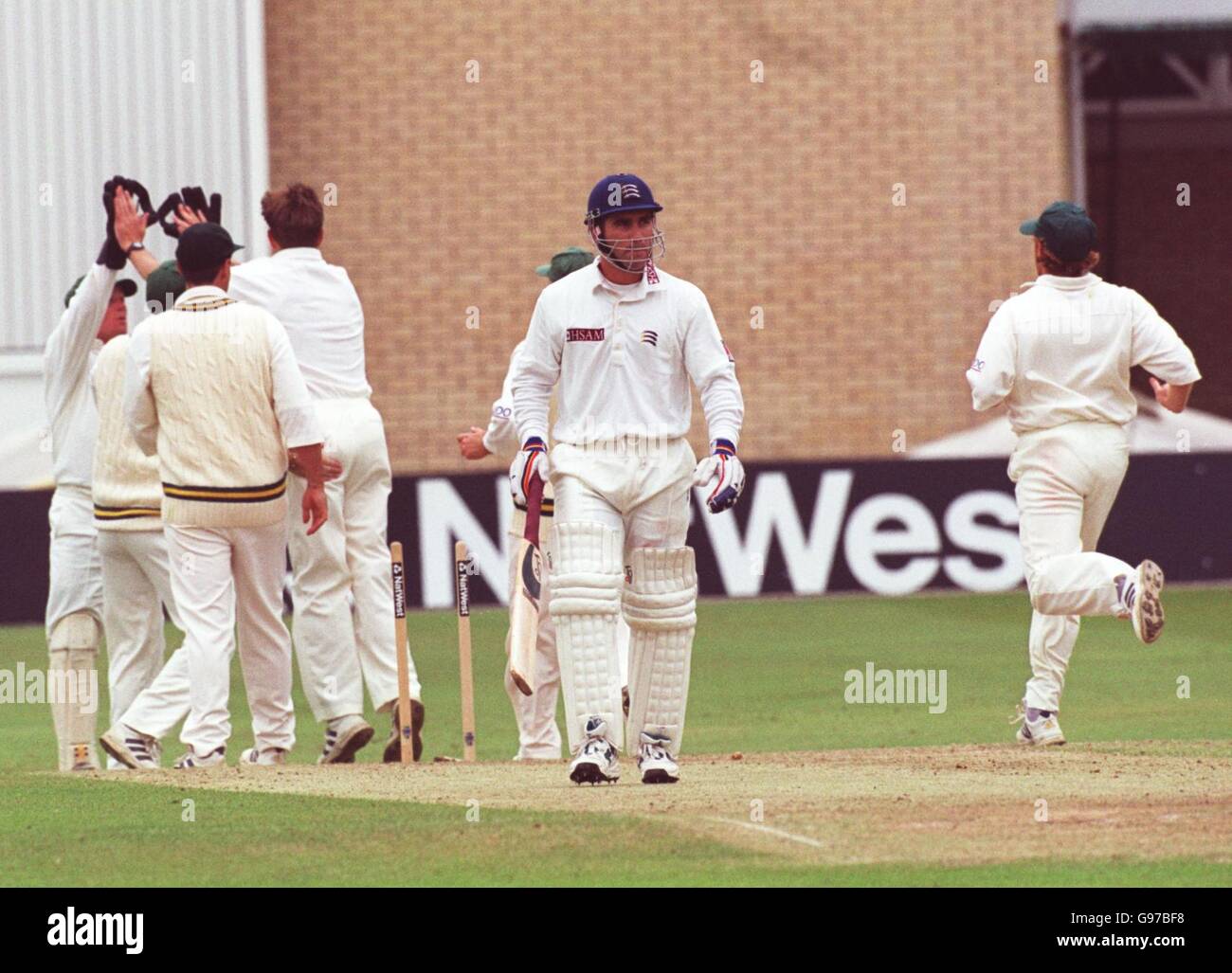 Nottinghamshire celebrate the wicket of Justin Langer of Middlesex who ...