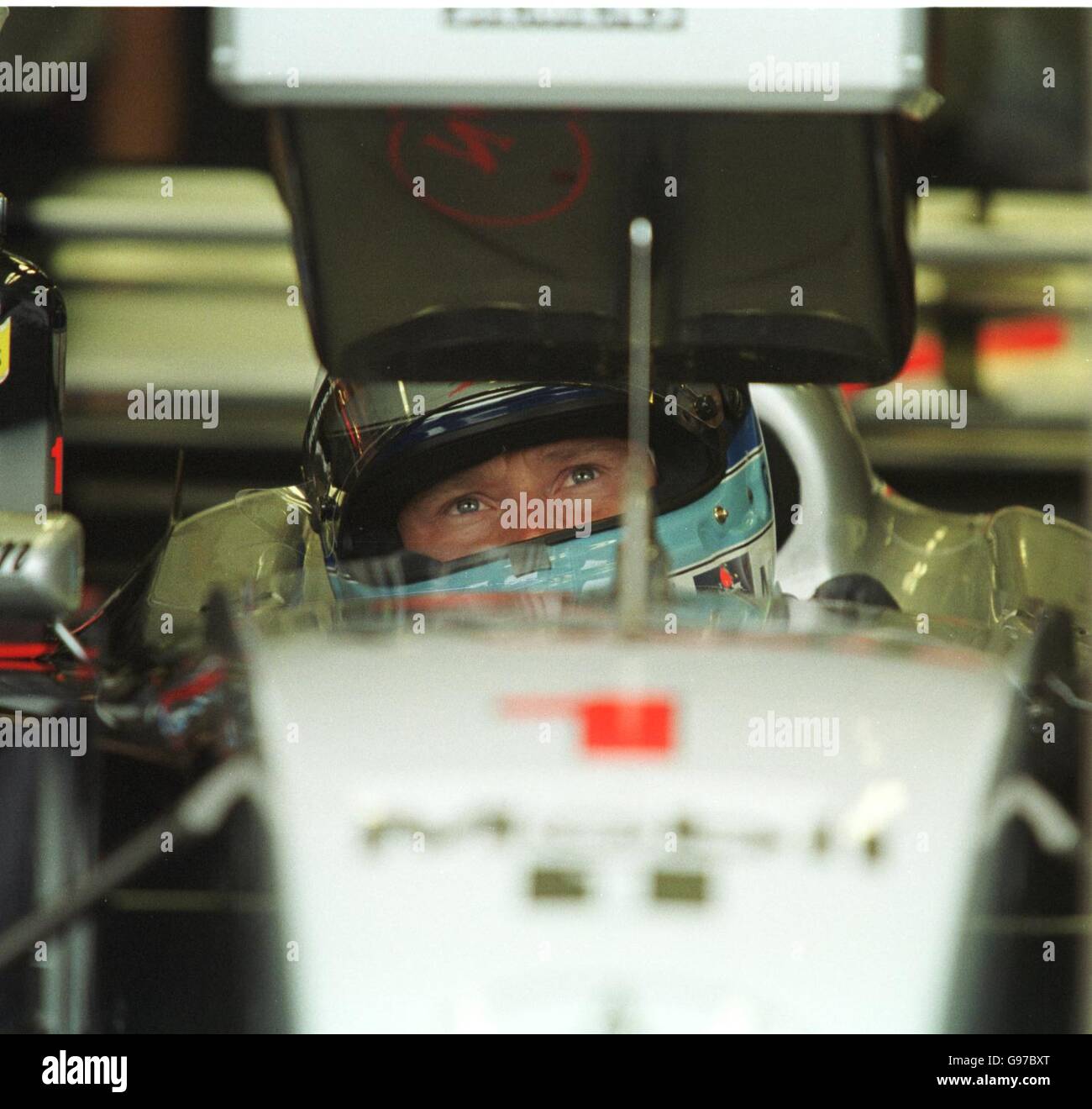 Formula One Motor Racing - Hungarian Grand Prix - Practice. Mika Hakkinen watches his rivals ...