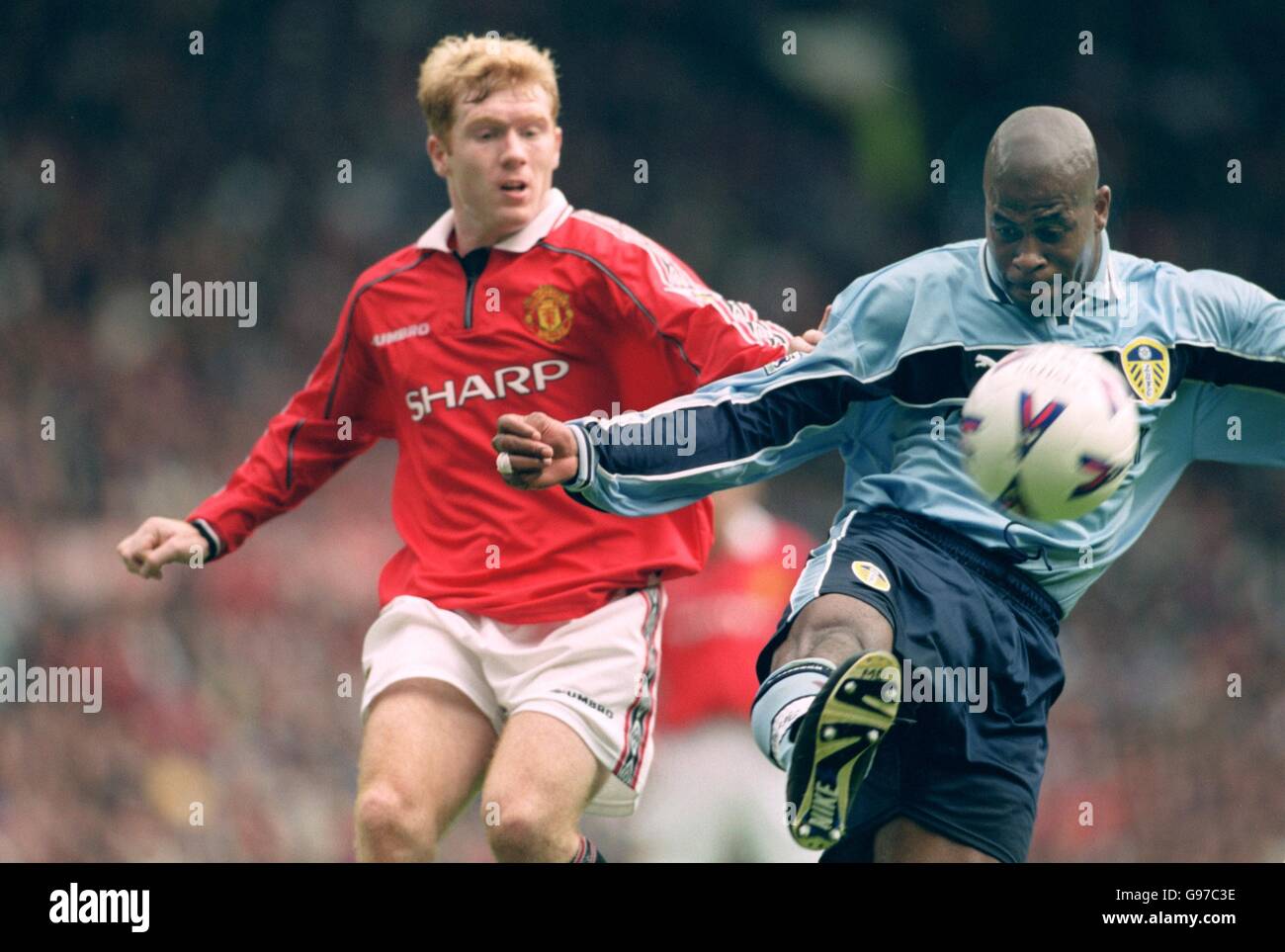 Leeds United's Michael Duberry clears from Manchester United's Paul ...