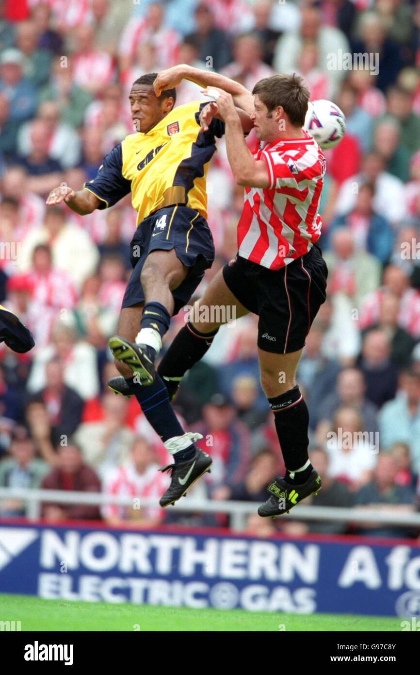 Arsenal's Thierry Henry (left) contests a high ball with Sunderland's ...