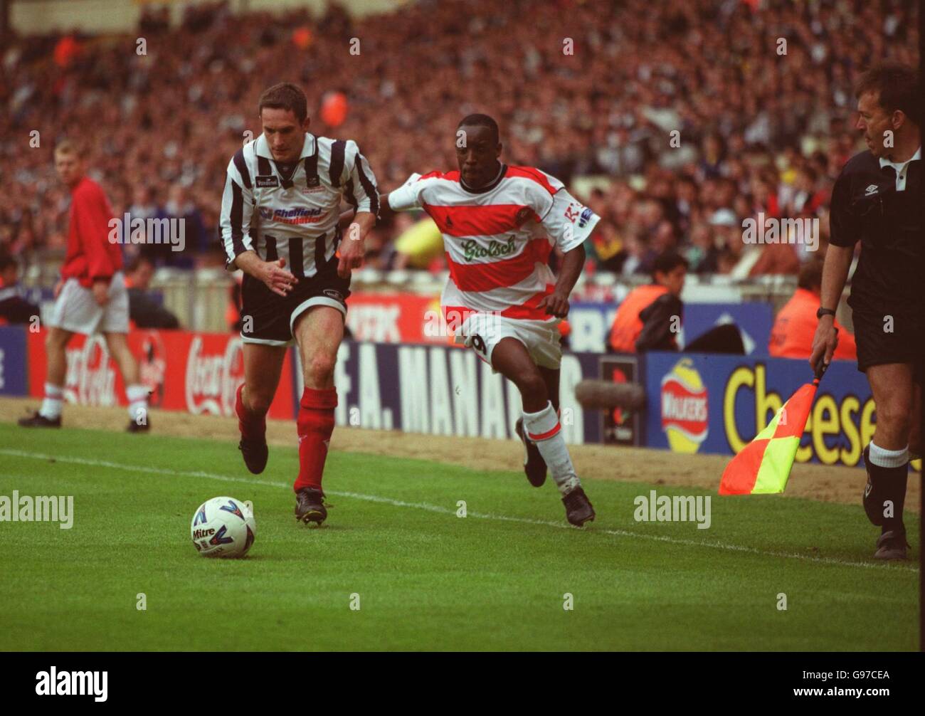 Kingstonian's Kevin Rattray (right) takes on Forest Green Rovers' Ian ...