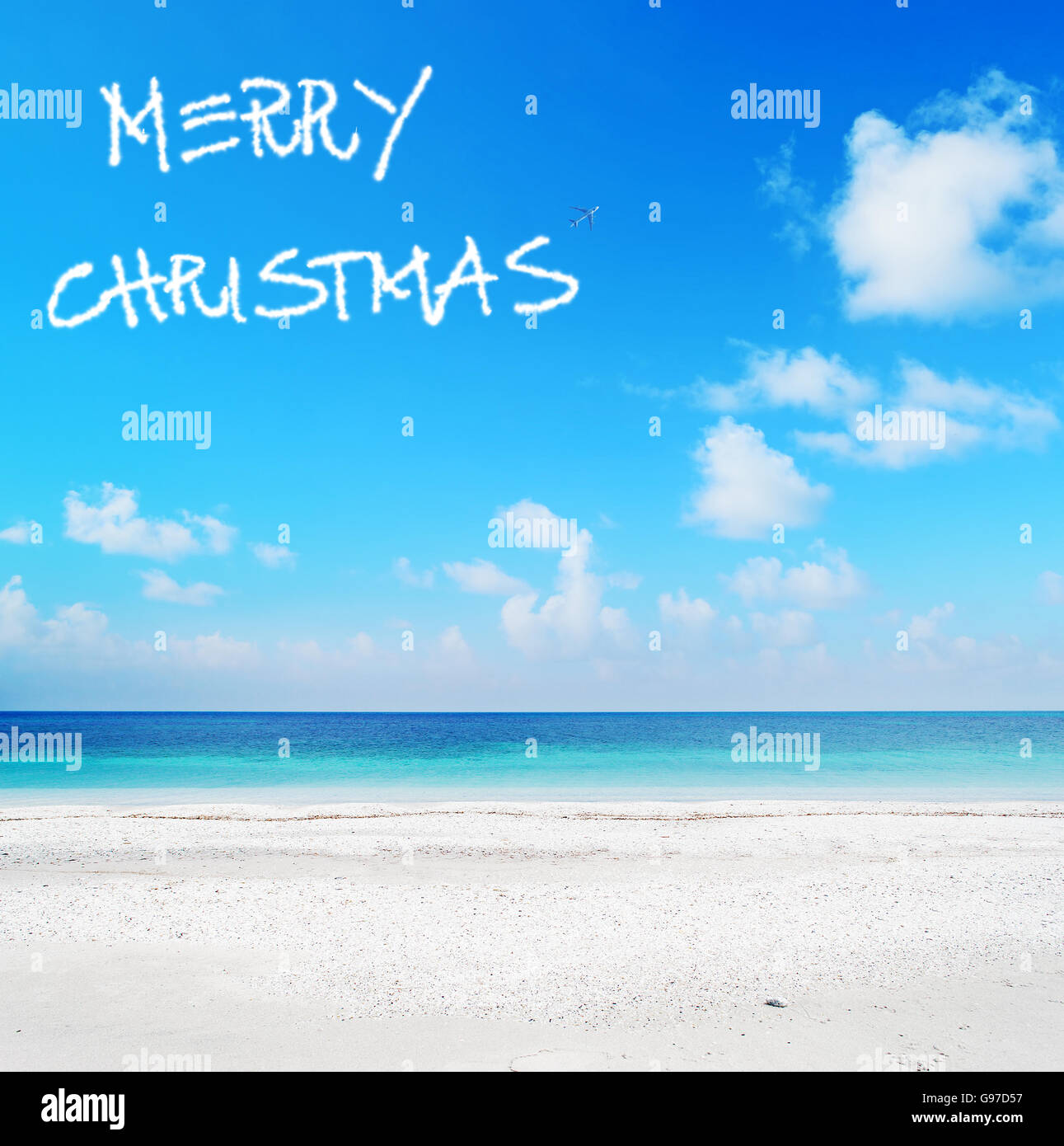 writing in the blue sky over a tropical beach Stock Photo - Alamy