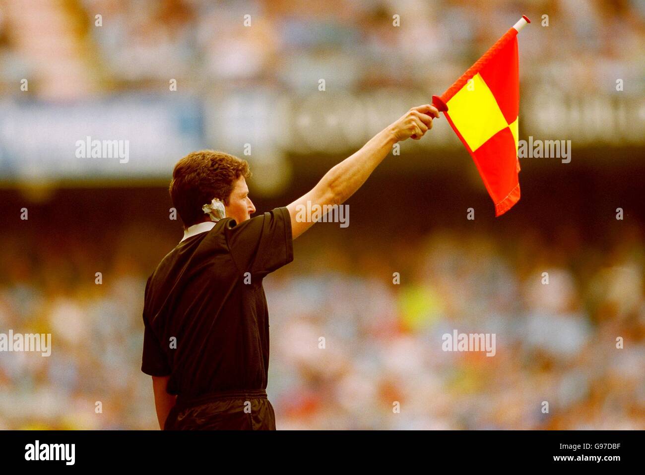 Assistant referee Wendy Toms, wearing an earpiece connecting her to the ...