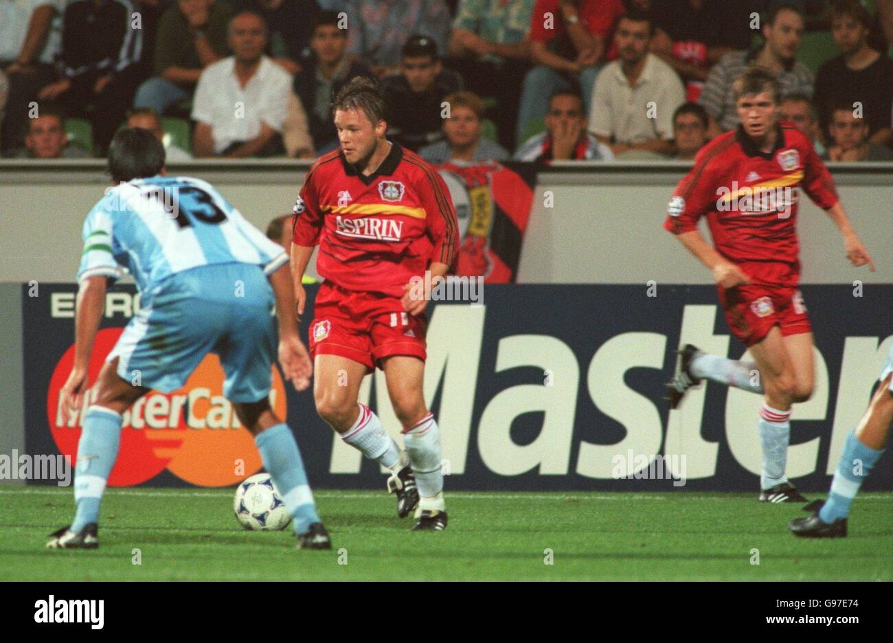 Bayer Leverkusen's Thomas Reichenberger is watched by Lazio's ...