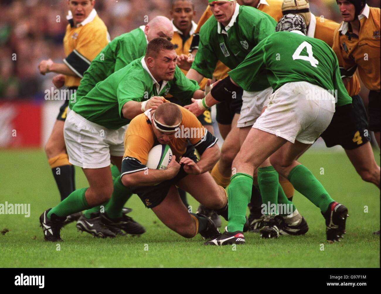 Australia's Richard Harry (centre) dives between Ireland's Justin ...