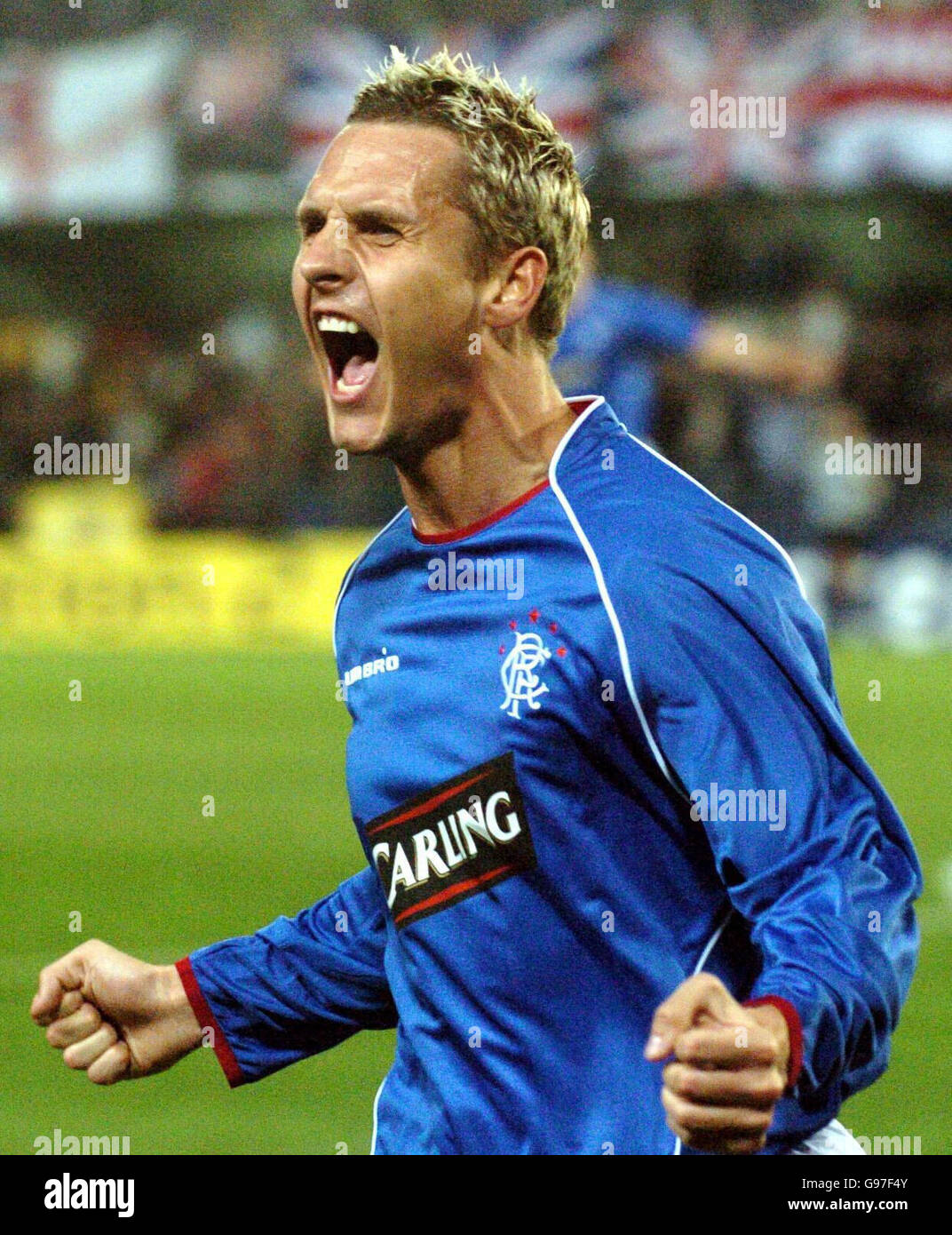 Rangers Peter Lovenkrands celebrates scoring during the Champions ...