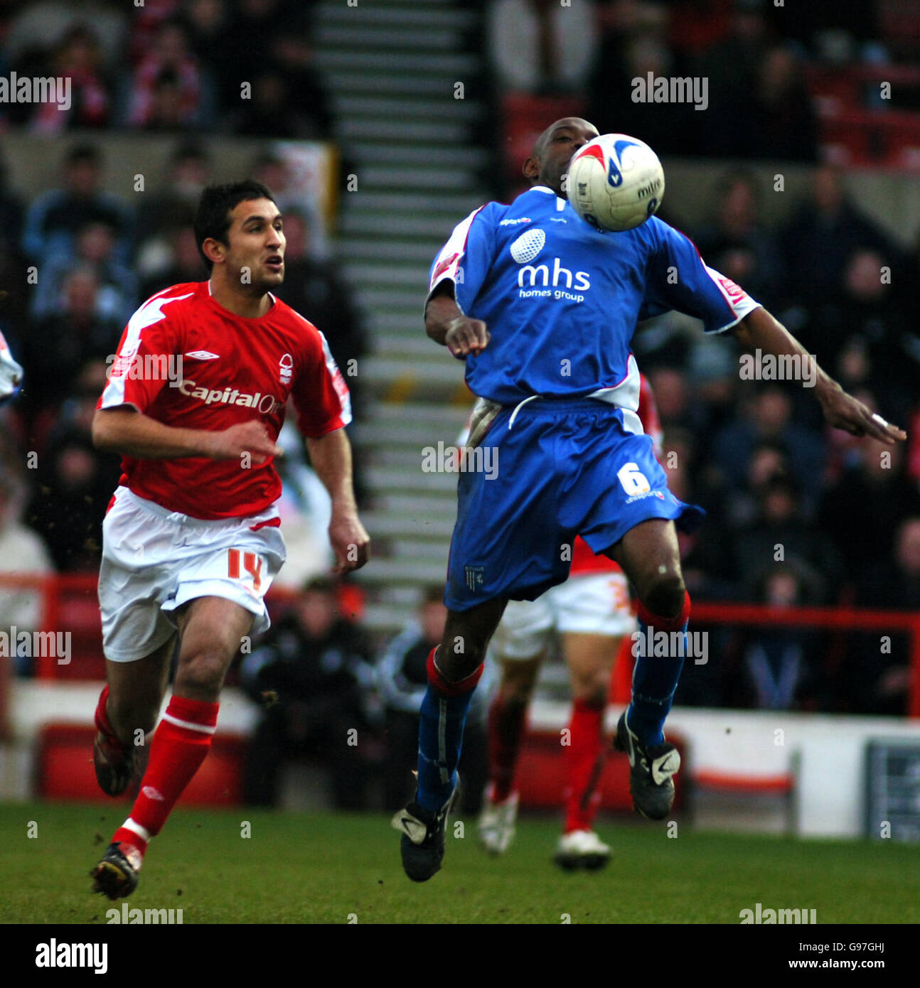 Nottingham Forest's Jack Lester and Gillingham's Ian Cox in action ...
