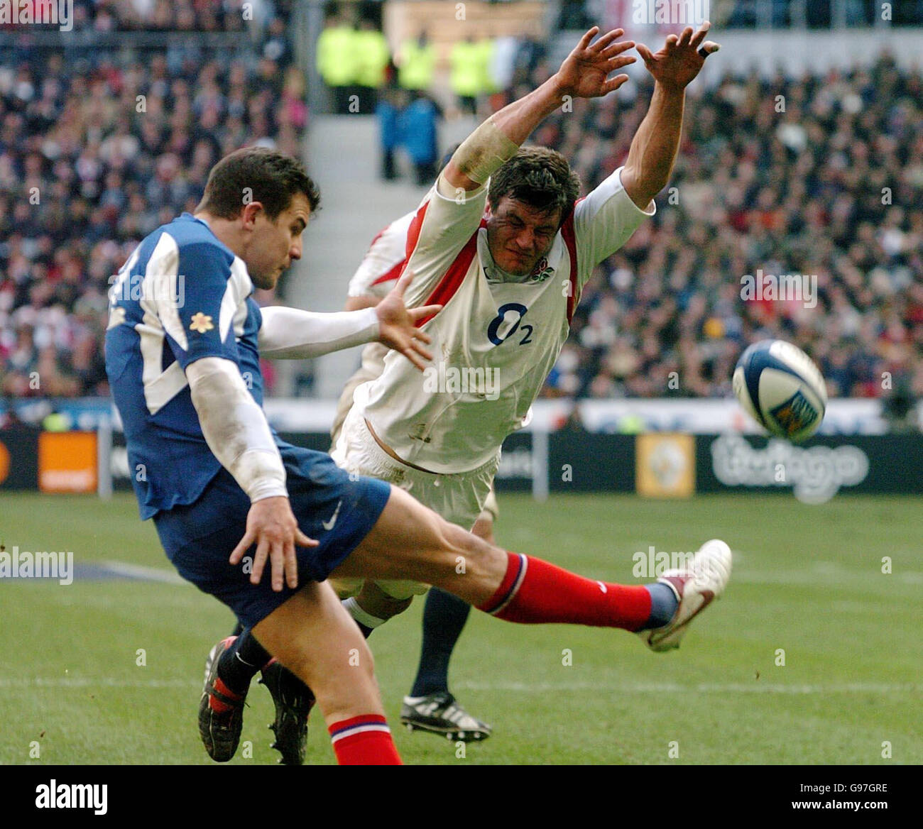 France's Damien Traille clears under pressure from England's Martin ...