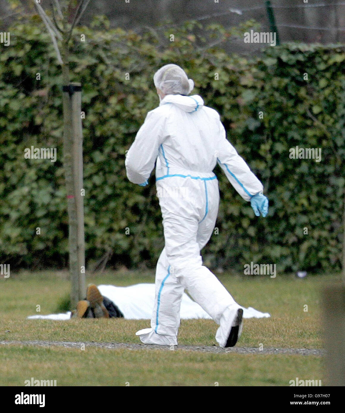 Note Graphic Content A Police Forensic Officer Walks Past A Covered