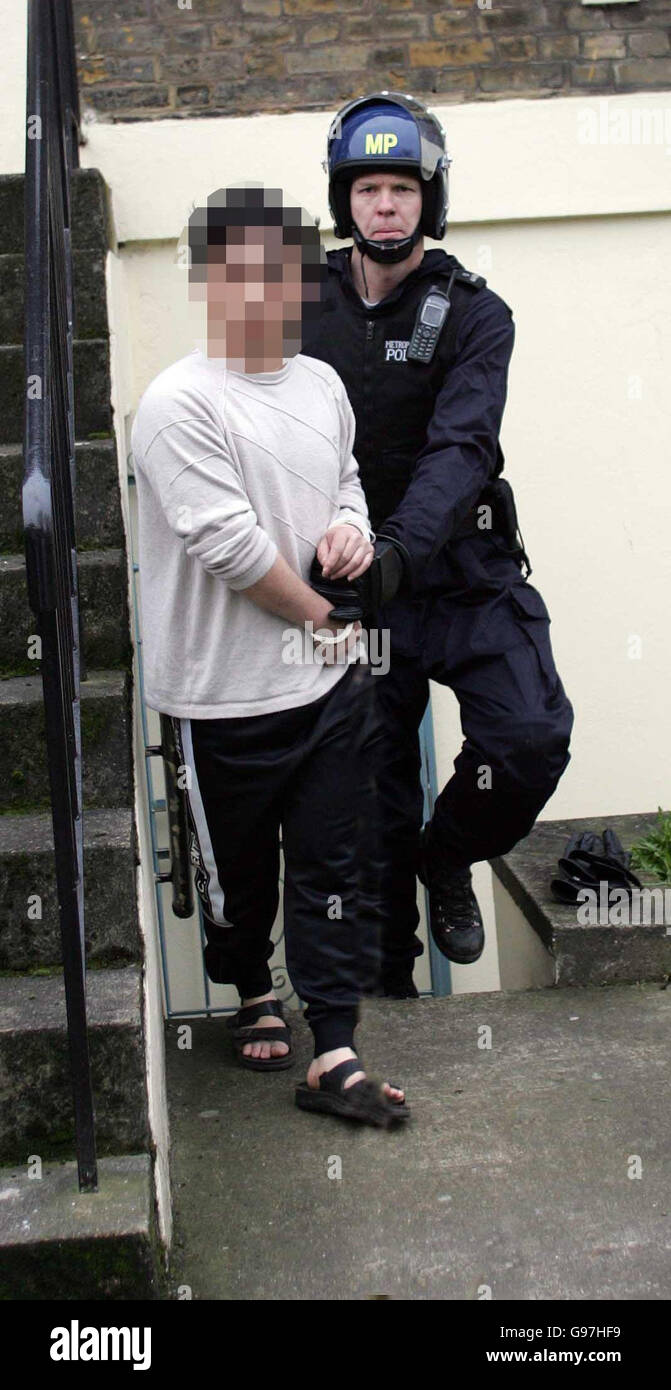 Police make an arrest after a raid at a house in Woolwich, London ...