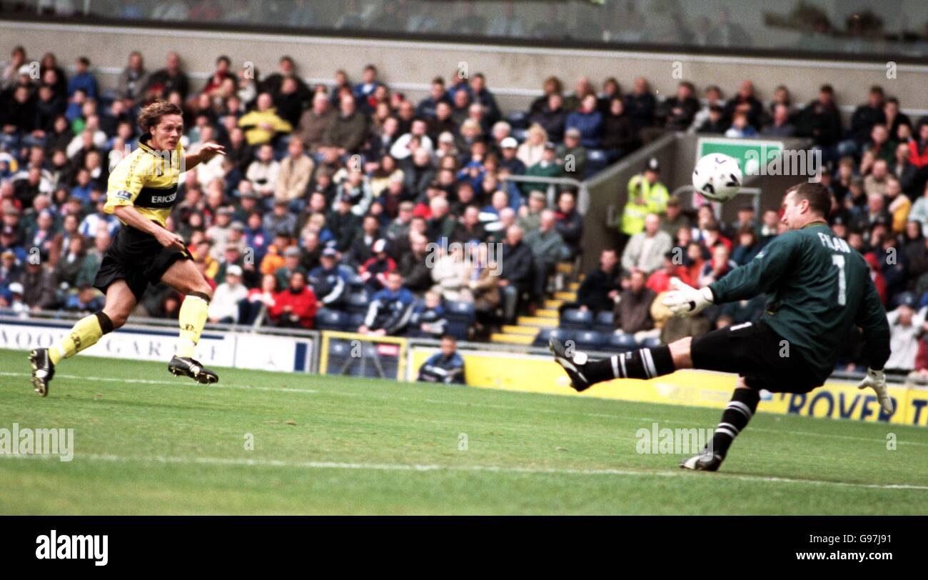 Queens Park Rangers's Stuart Wardley fires the ball past Blackburn ...