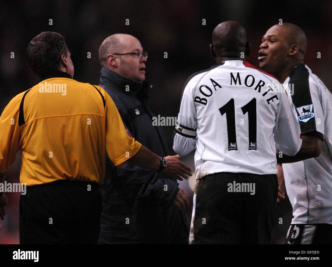 Fulhams collins john follows referee alan wiley off the pitch hi-res ...