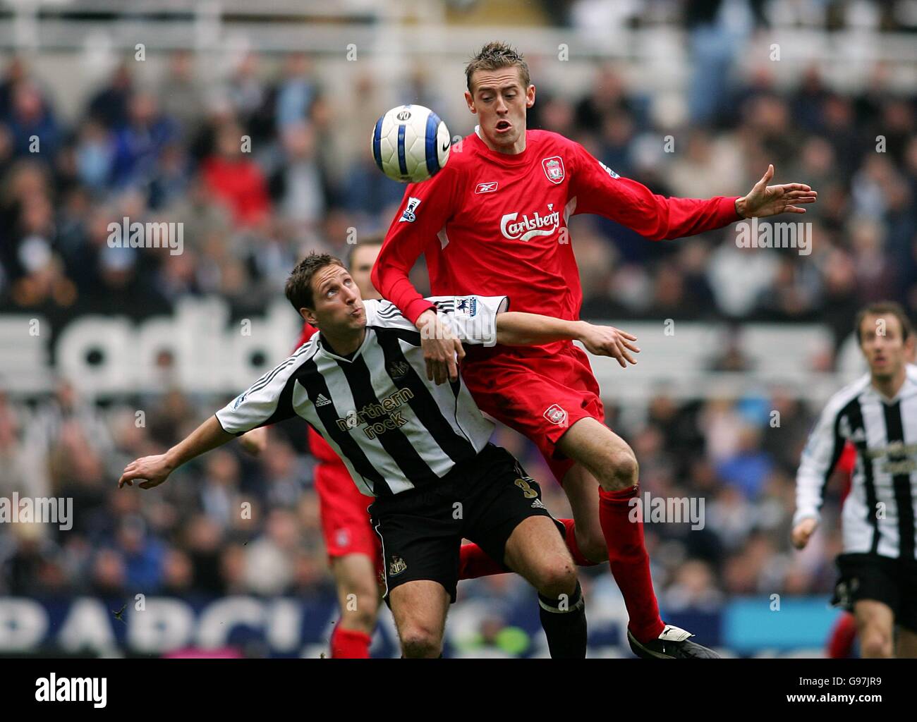 Newcastle United's Robbie Elliott and Liverpool's Peter Crouch battle ...