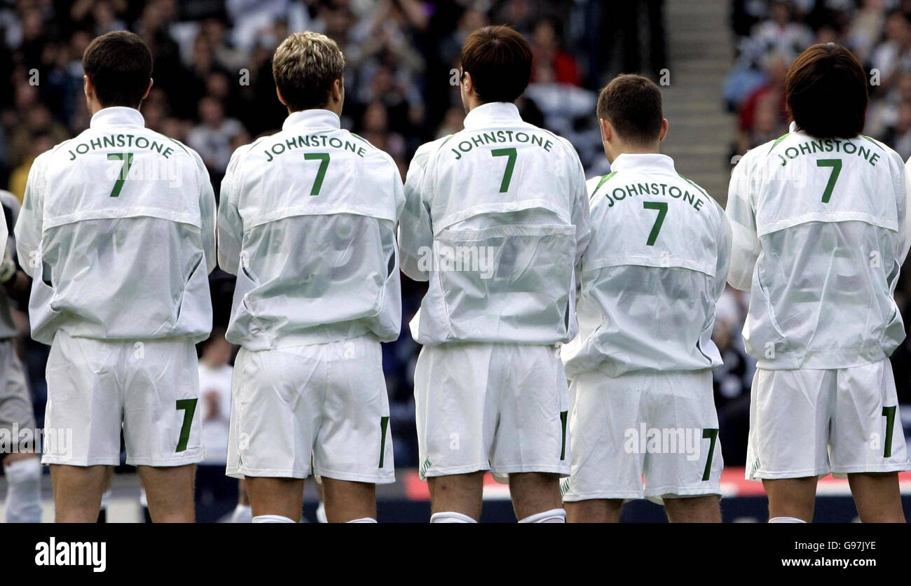 Celtic players line-up displaying the number '7' on their backs and ...